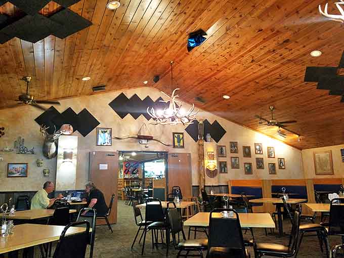 Warm pine ceilings and antler chandeliers create the perfect rustic backdrop for conversations that flow as easily as the drinks.