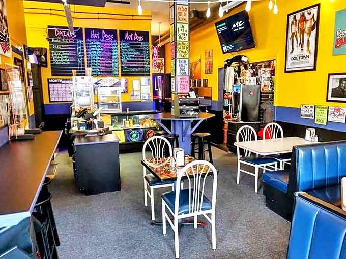 Bright yellow walls and classic diner vibes create the perfect backdrop for both serious eating and superhero discussions.