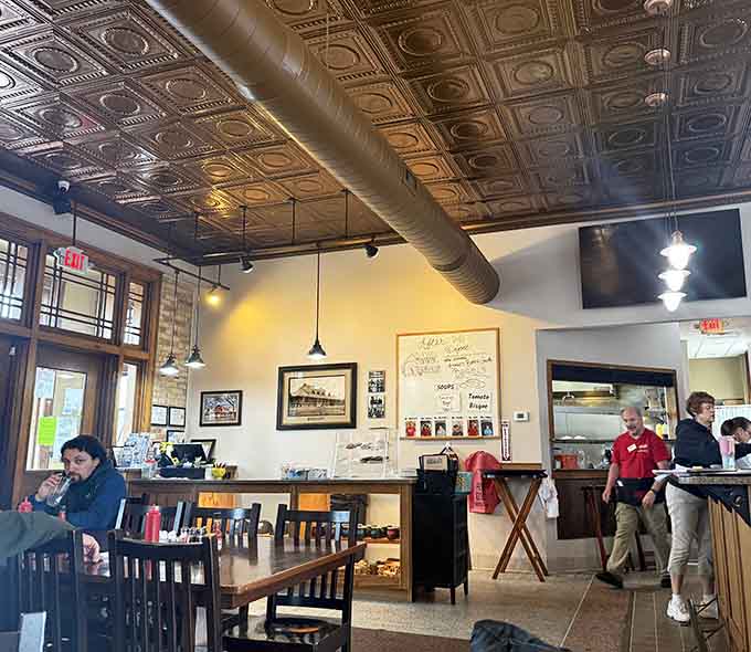 Inside, decorative tin ceilings and warm lighting create an atmosphere that's equal parts historic charm and cozy comfort, perfect for lingering over coffee.