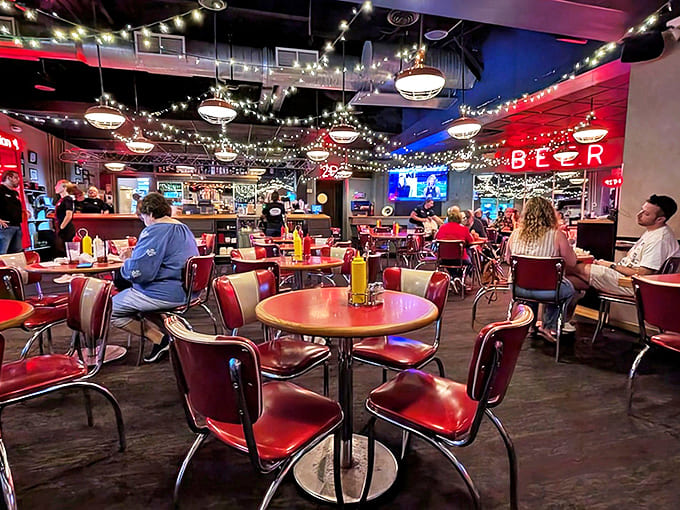 Interior: String lights dance overhead while red vinyl booths invite you to settle in. This isn't just dining&mdash;it's time travel with better food.