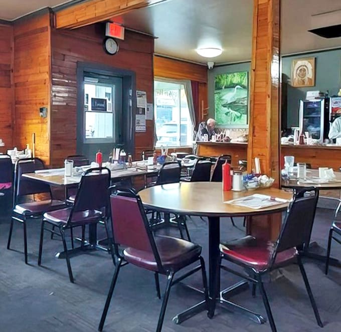 Inside: Warm wood paneling and no-nonsense tables create that classic diner atmosphere where comfort trumps pretension and conversations flow as freely as the coffee.