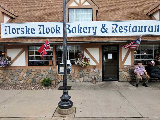 Wow, what a sight! This charming exterior is more Norwegian than a fjord full of Vikings, complete with flags that'll make you want to yodel.