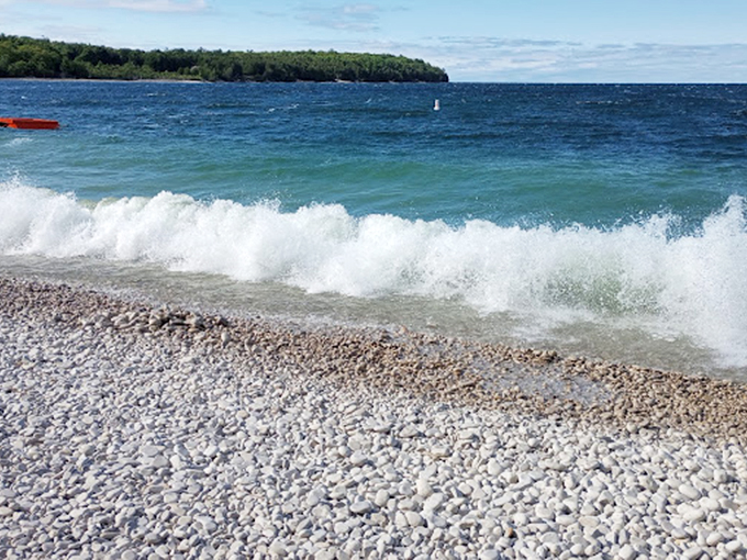 Smooth limestone pebbles replace sand, creating nature's own zen garden. Don't forget your yoga mat!