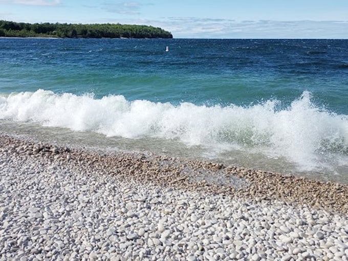 Smooth limestone pebbles replace sand, creating nature's own zen garden. Don't forget your yoga mat!