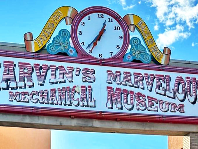 Marvin's Marvelous Mechanical Museum announces itself with a giant clock and vibrant signage, promising timeless fun inside its treasure-filled walls.