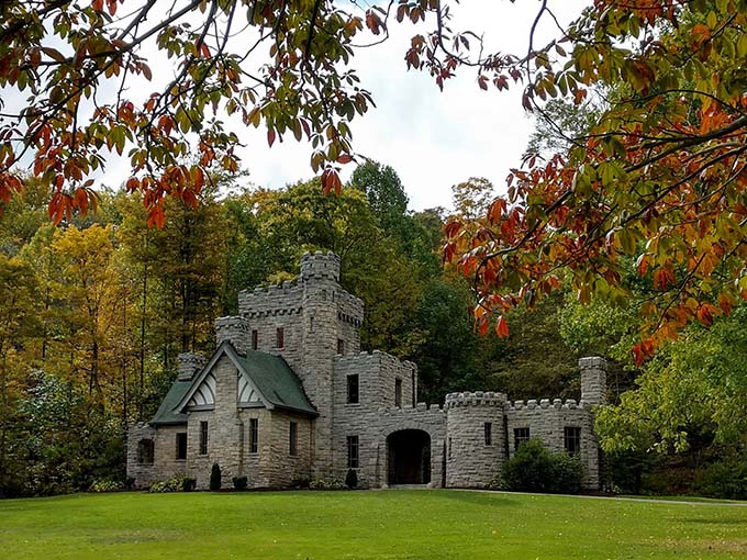 Squire's Castle emerges from its woodland setting like a forgotten fortress, its weathered stone walls telling stories of ambition and dreams.