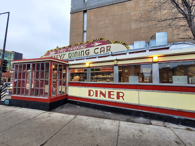 Gleaming chrome and neon dreams! This vintage diner car is where the 1950s park permanently on your plate.