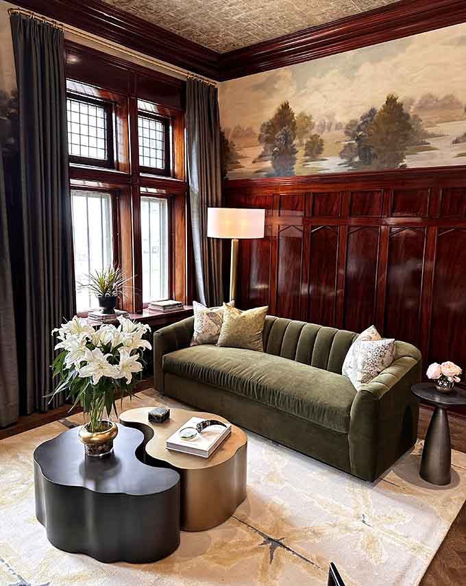 Lush gardens frame the Pillsbury Castle Project, where manicured hedges provide the perfect setting for this historic stone mansion's grand presence.