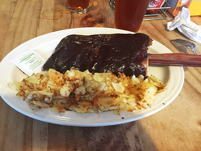 Meat your match! This slab of beefy perfection, nestled beside golden hash browns, is what carnivorous dreams are made of. Napkins required!