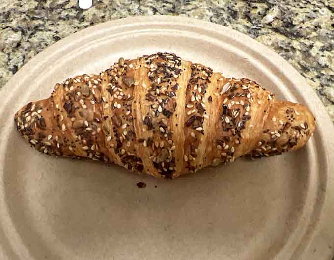 This everything-crusted croissant proves that sometimes perfection comes with seeds, sesame, and poppy working together in buttery harmony.