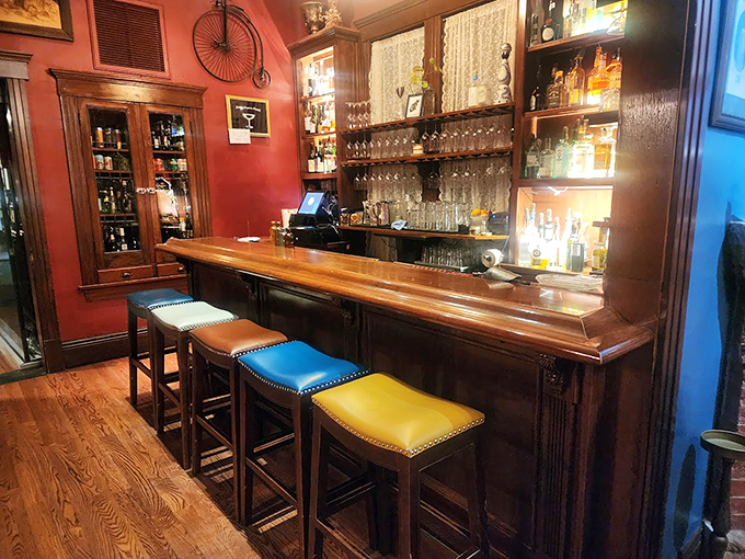 Welcome to the speakeasy of your dreams! This bar's got more character than a Wes Anderson film, with colorful stools that'll make your cocktail hour feel like a carnival.