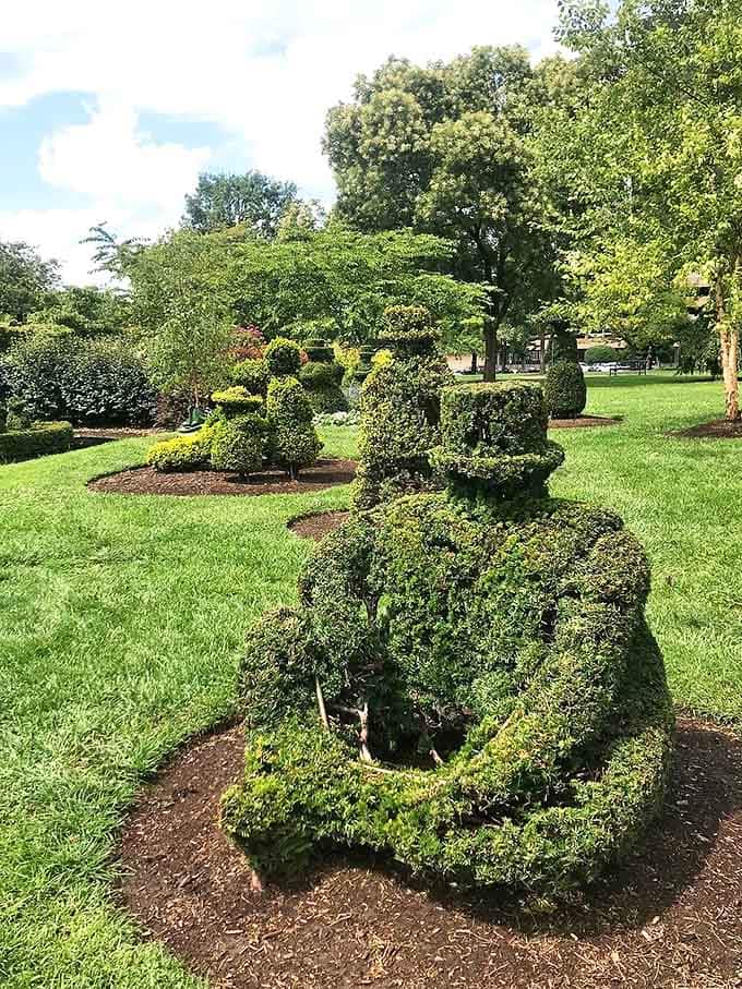 This isn't your average garden gnome – these meticulously shaped figures bring artistic vision to life through patient pruning.