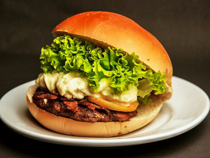 Behold the burger of your dreams! Juicy, stacked, and ready to fuel your Route 66 adventure.