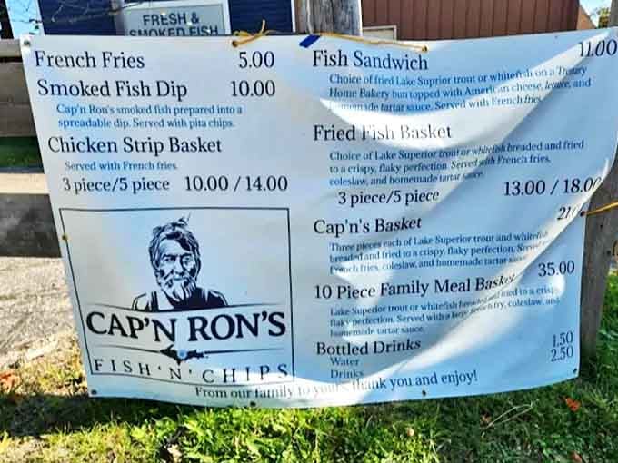 The menu board tells a simple story: fresh fish, prepared with care, no fancy frills needed when the ingredients speak this loudly.