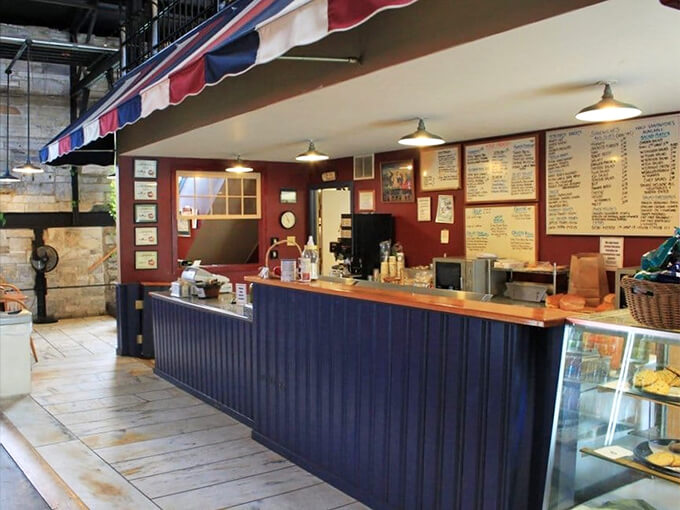 The menu board glows like a beacon of sandwich salvation, promising delicious possibilities in bright digital blue.