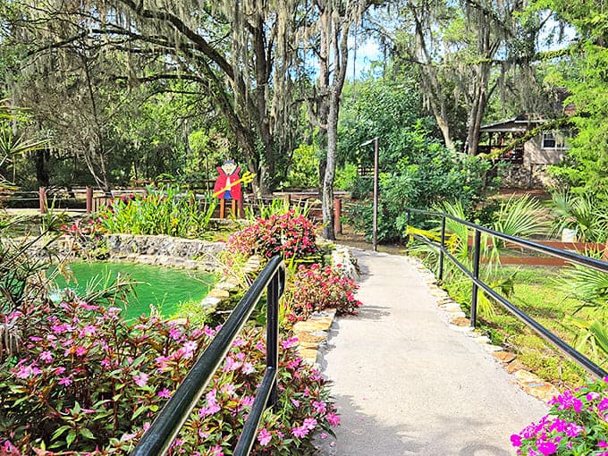 A garden path lined with vibrant flowers leads visitors through grounds as enchanting as the spring itself.