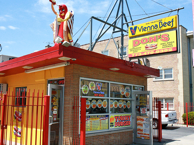 Hot dog royalty reigns supreme atop this yellow castle of culinary delights. All hail the king of comfort food!