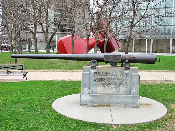Pulaski Square's solemn memorial stands in thoughtful contrast to the playful Free Stamp nearby &ndash; Cleveland's perfect balance of reverence and whimsy.