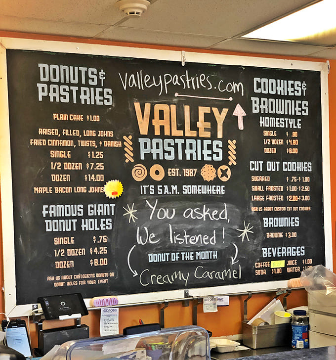 The menu board promises giant donut holes and creative flavors, basically a choose-your-own-adventure in sugar form.