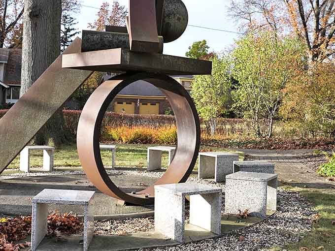 Geometric precision meets artistic vision in this circular installation, where negative space becomes as important as solid form.