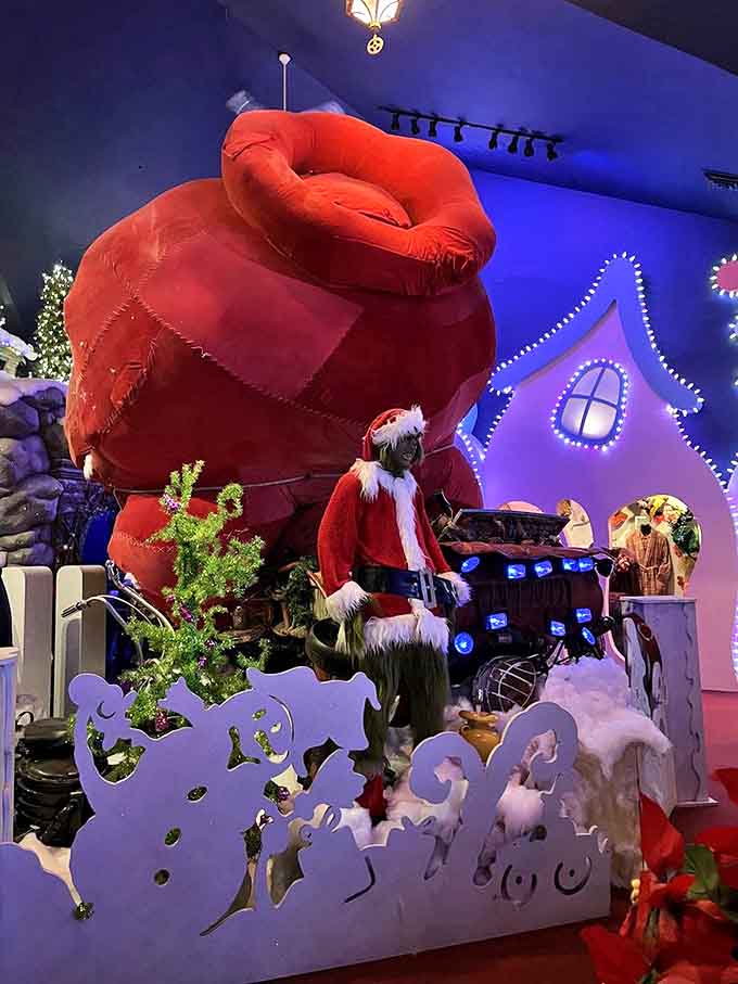 The Grinch himself would approve of this elaborate display featuring his likeness and that infamous oversized red sack, ready to steal Christmas all over again.