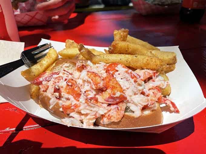 Behold the lobster roll in all its glory, proof that sometimes the simplest preparations are the most spectacular when done right.