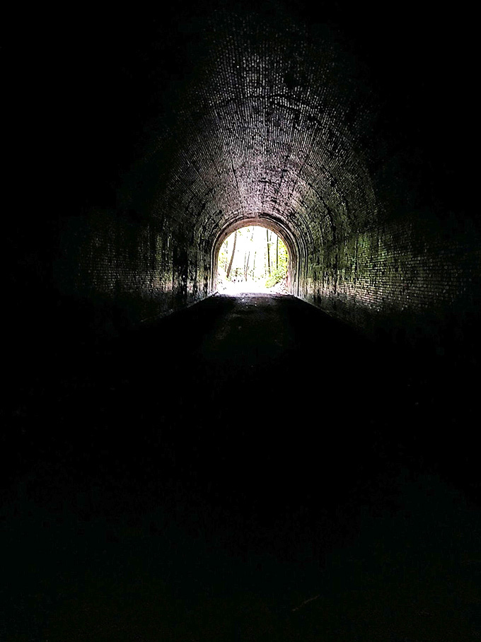 Light at the end of the tunnel? Or perhaps something else entirely waiting in this brick-lined passage.