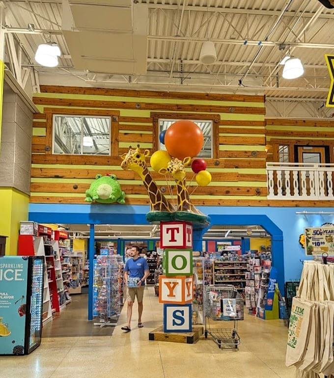 Giant toy blocks tower overhead because apparently someone decided groceries needed more childhood nostalgia mixed in.