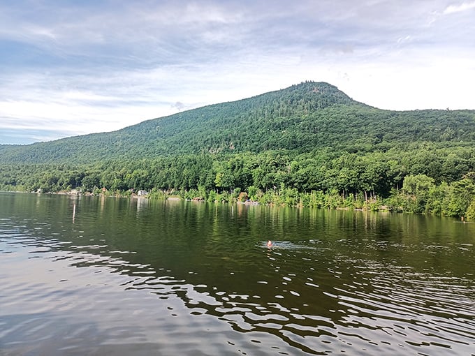 Lake Dunmore stretches like a mirror beneath Mount Moosalamoo, reflecting Vermont's majestic Green Mountains in its crystal-clear waters.