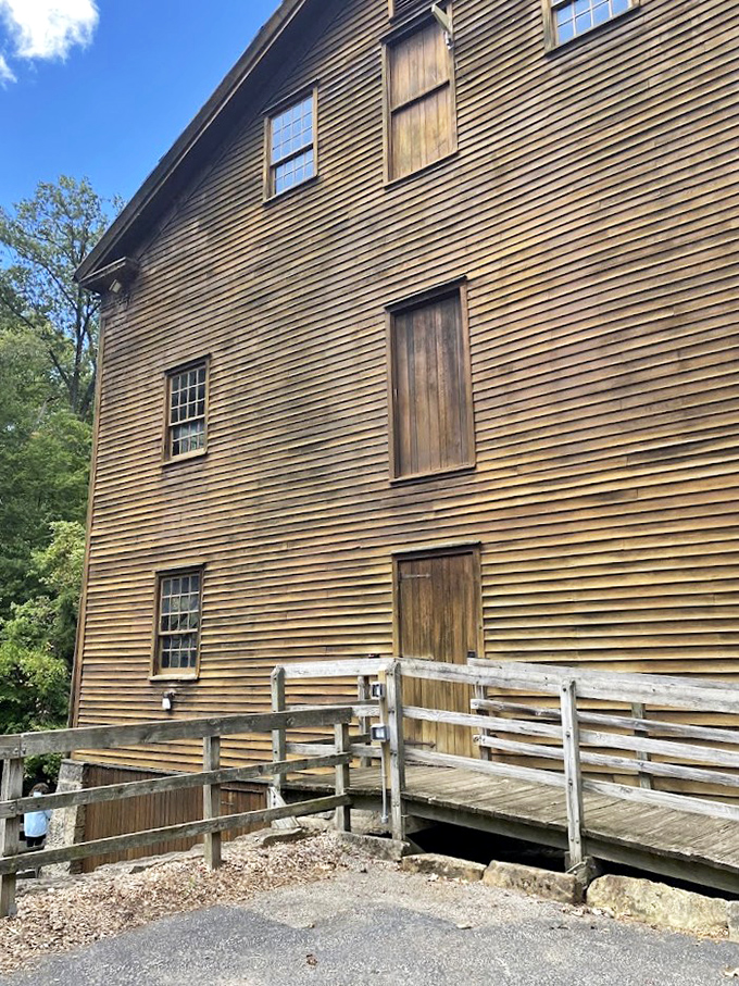 The mill's weathered wooden exterior tells stories of centuries past, each plank a chapter in Ohio's industrial history.