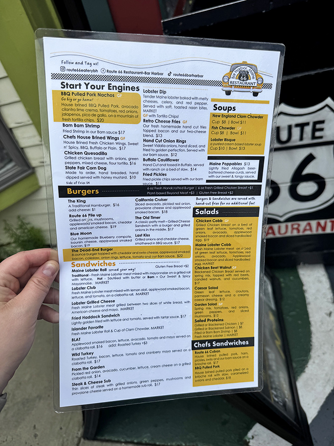 The menu tempts with "Start Your Engines" appetizers and seafood classics, though the legendary lobster roll remains the star attraction.