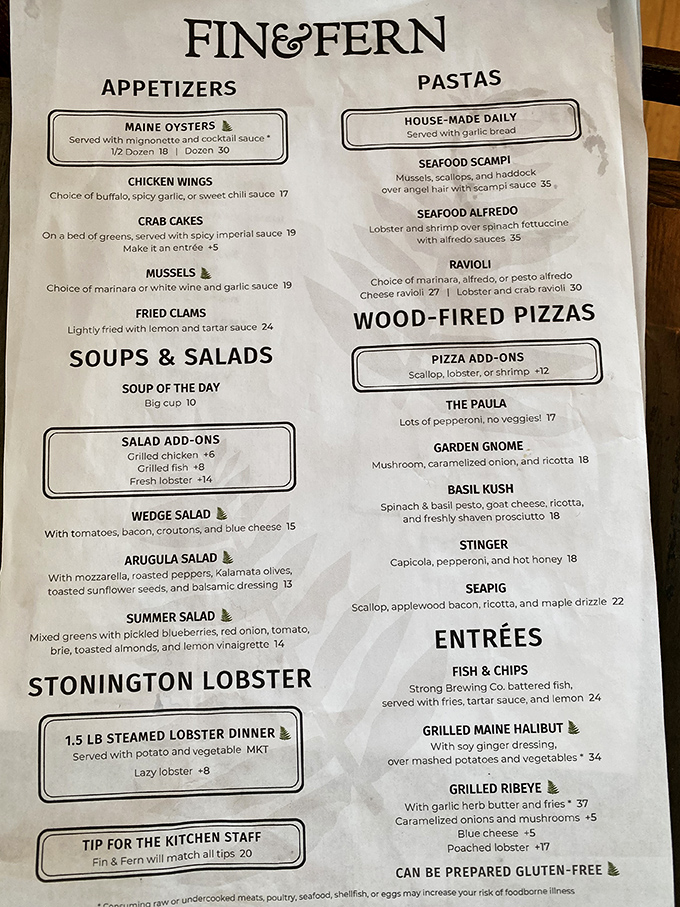 The menu reads like a love letter to coastal Maine, featuring everything from fresh oysters to wood-fired pizzas with seafood toppings.