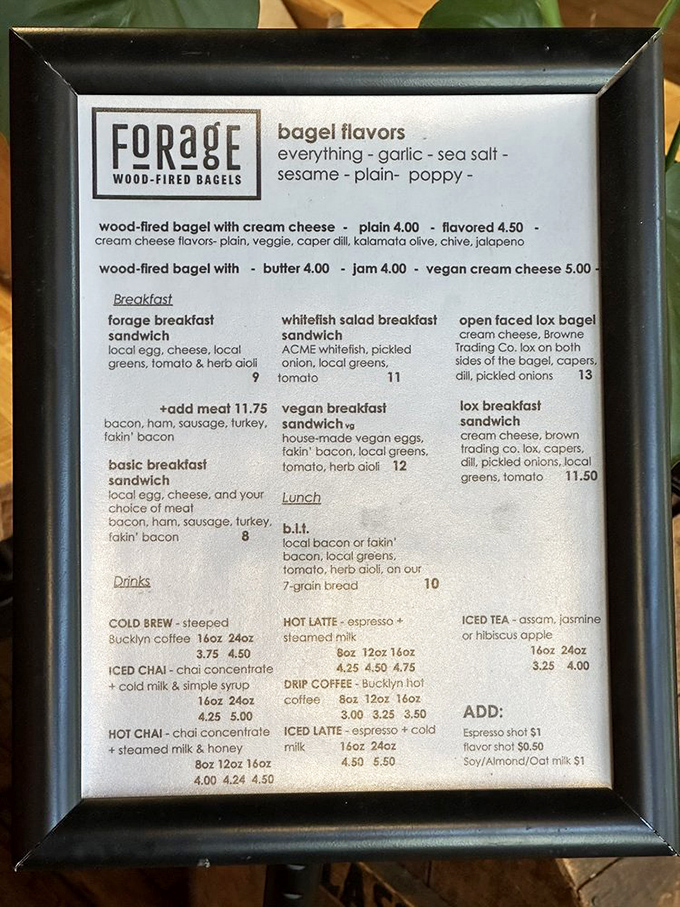 The menu board reveals a thoughtful selection of bagel varieties and sandwich combinations, each promising a perfect morning bite.