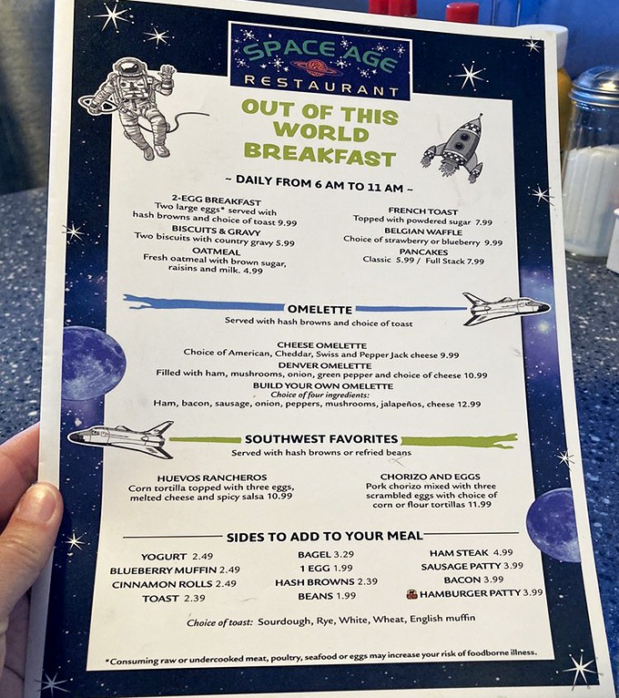The "Out of This World Breakfast" menu promises astronomical satisfaction with classics like eggs, French toast, and omelets served until 11 AM daily.