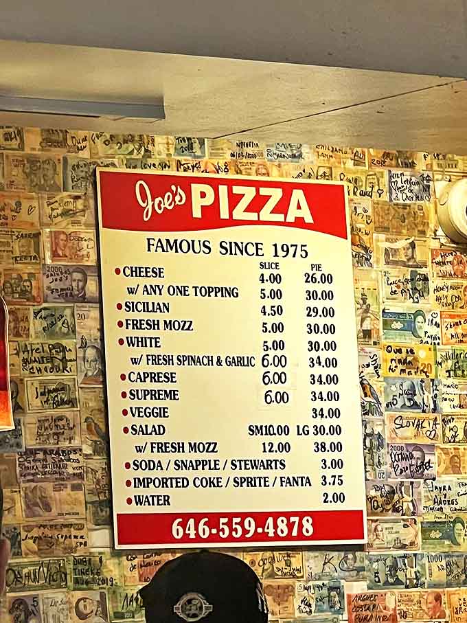 Famous since 1975, this menu board tells a delicious story with its classic offerings &ndash; the wall of dollar bills behind it holds thousands of visitor memories.