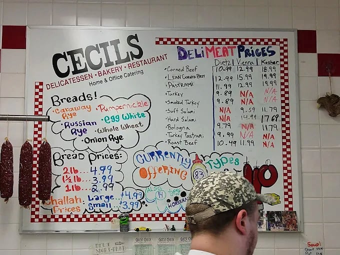 The menu board at Cecil's isn't just a list &ndash; it's a historical document written in colorful marker and sandwich possibilities.