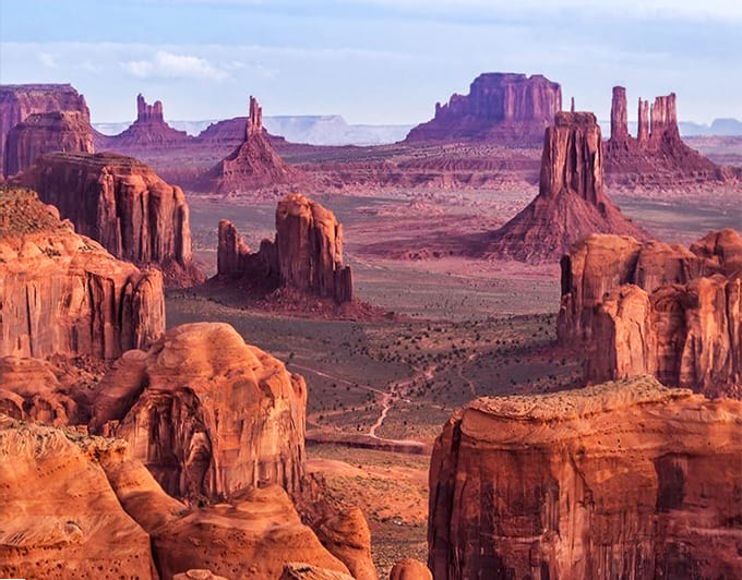 From above, Monument Valley looks like a giant's chess set, with massive stone pieces scattered across the red desert board.