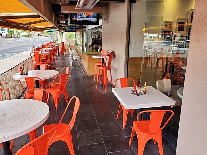 Sidewalk chic meets breakfast bliss. These orange chairs are brighter than your future after that first sip of coffee.