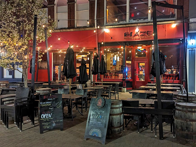 String lights twinkle above wooden barrels and blooming flowers, creating Maine's answer to a European sidewalk caf&eacute;.