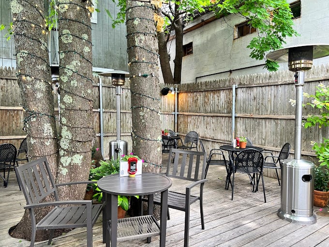 Who needs a fancy patio when you've got this hidden gem? It's like finding a secret garden, but with the promise of lobster at the end.