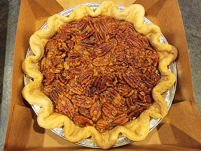 This pecan pie isn't just dessert&mdash;it's architecture. Golden pecans arranged like rooftop shingles over a caramel filling that whispers sweet nothings.