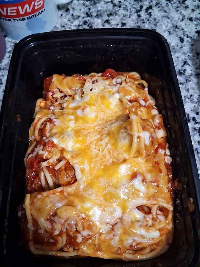 Behold the mac-and-cheese that launched a thousand return visits, bubbling with golden cheese like edible treasure in a takeout container.