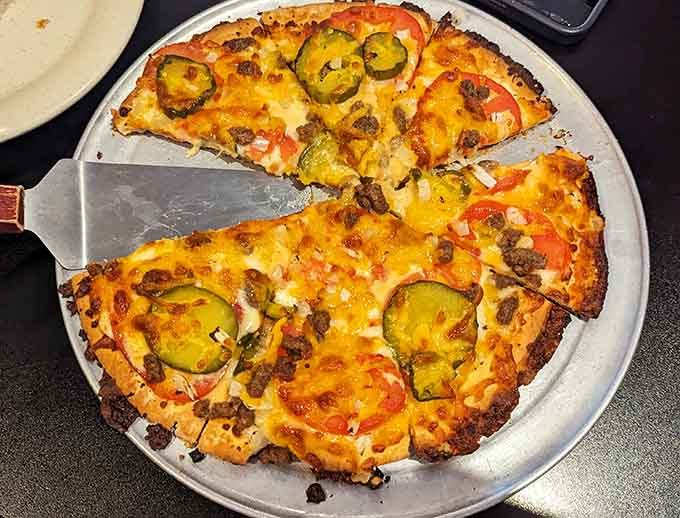 Behold the beauty of melted cheese and perfectly placed jalape&ntilde;os creating a spicy masterpiece that would make any pizza purist weep with joy.