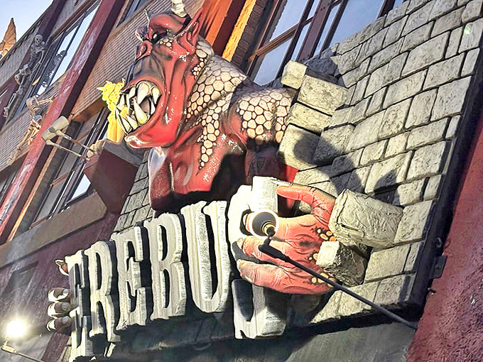 Side of Sign: This demonic guardian seems to be saying, "Enter if you dare," with a smile that promises nightmares for weeks.