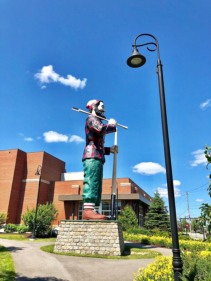 From this angle, Paul's massive ax and confident stance show why he's been Bangor's unofficial greeter since 1959 &ndash; nobody makes an entrance like a 3,700-pound lumberjack.