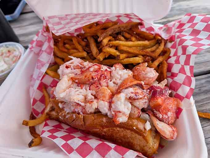 Behold the lobster roll in all its glory: chunks of sweet, tender meat piled high on a buttery toasted bun, looking like something from a seafood lover's fever dream.