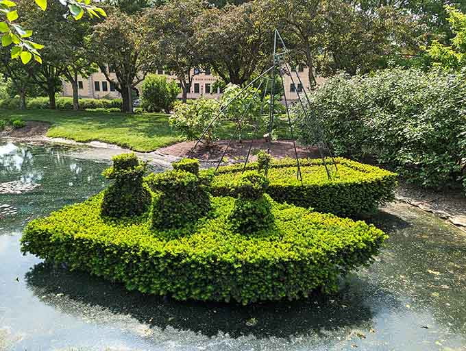That's a boat made entirely of bushes floating on actual water, because apparently someone decided regular boats were too mainstream.