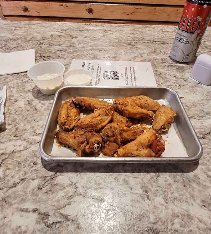 Golden, crispy wings arrive perfectly cooked, ready to be tossed in your choice of signature sauces for pure flavor bliss.