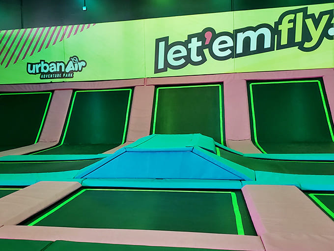 "Let 'em fly" indeed! The trampoline zone transforms ordinary humans into temporary astronauts experiencing the joy of weightlessness.