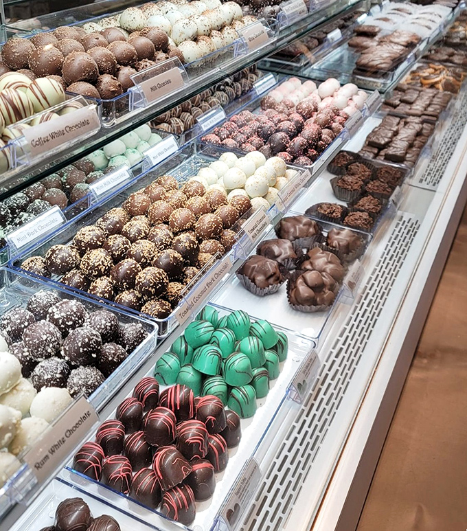 These aren't just chocolates, they're edible jewelry. Each truffle sits like a tiny masterpiece, promising flavor explosions that'll make your taste buds stand up and applaud.